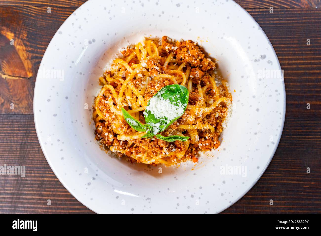 A delicious serving of spaghetti topped with a rich meat sauce and ...