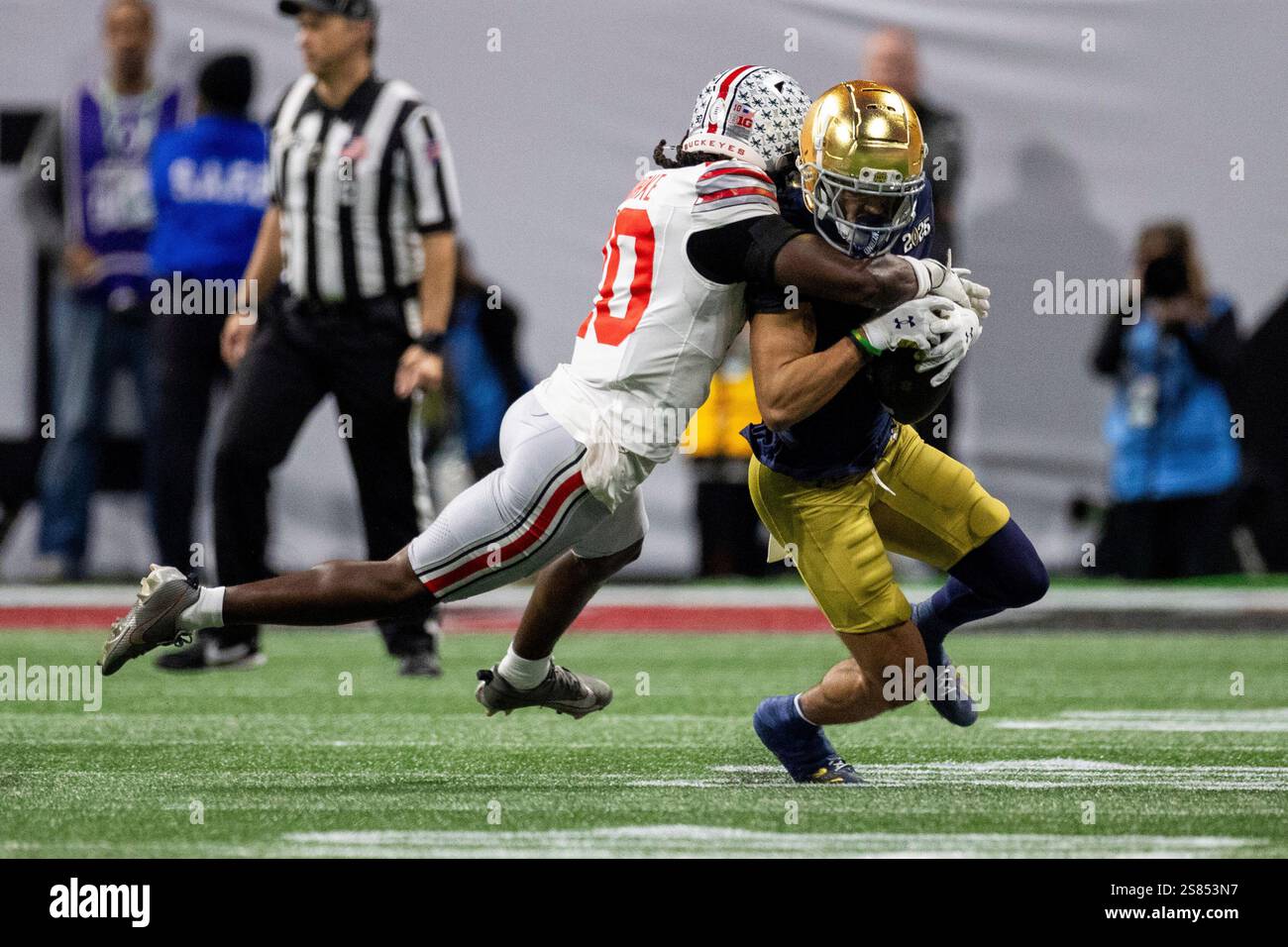 January 20, 2025: Ohio State cornerback Denzel Burke (10) tackles Notre Dame wide receiver ...