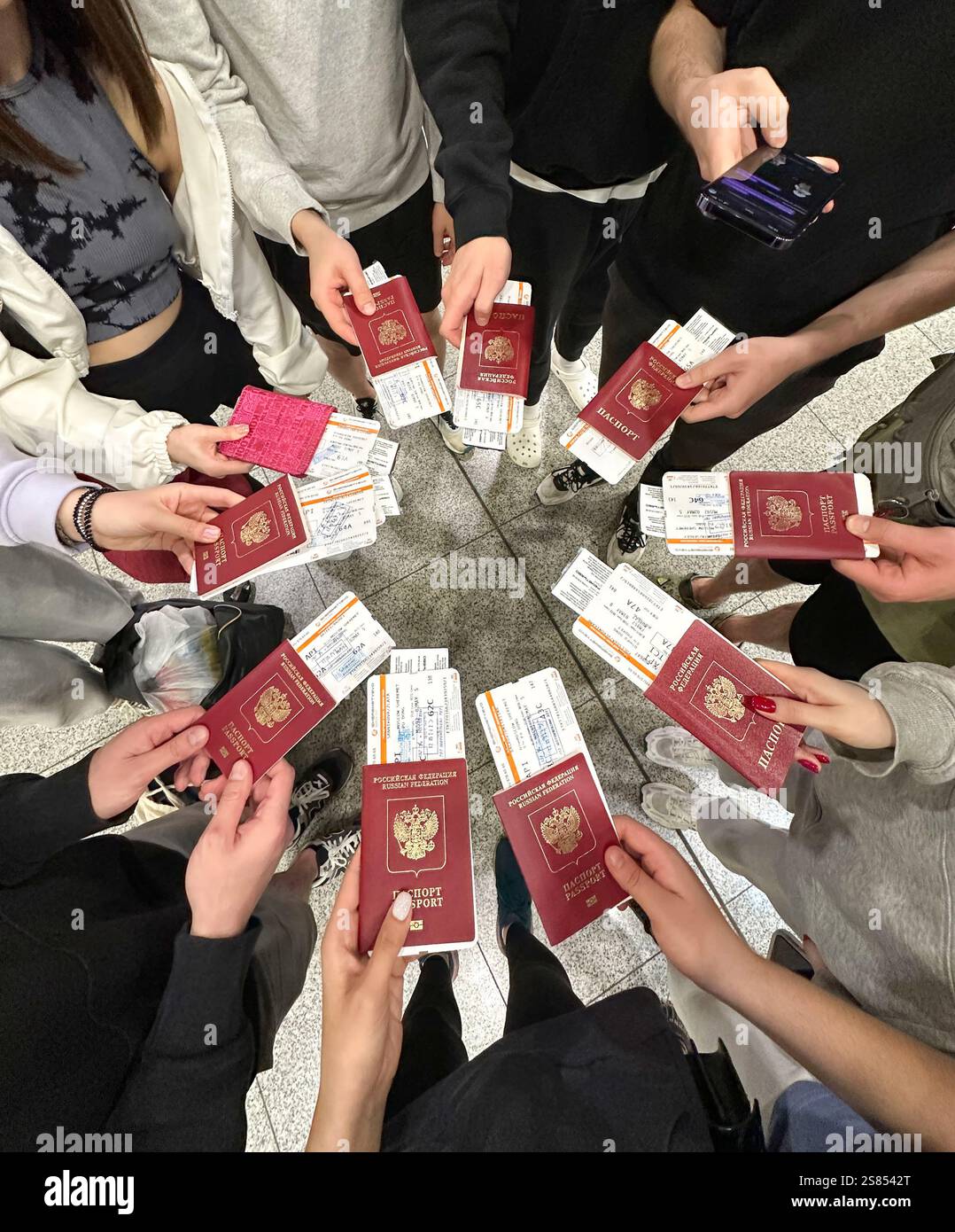 Hands group holding passport hi-res stock photography and images - Alamy