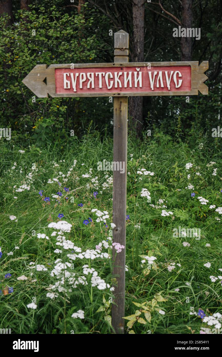 Weathered wooden signpost marking buryat village direction, nestled ...