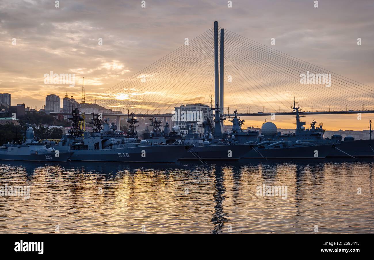 Russian navy warships are anchored in vladivostok harbor at sunset ...