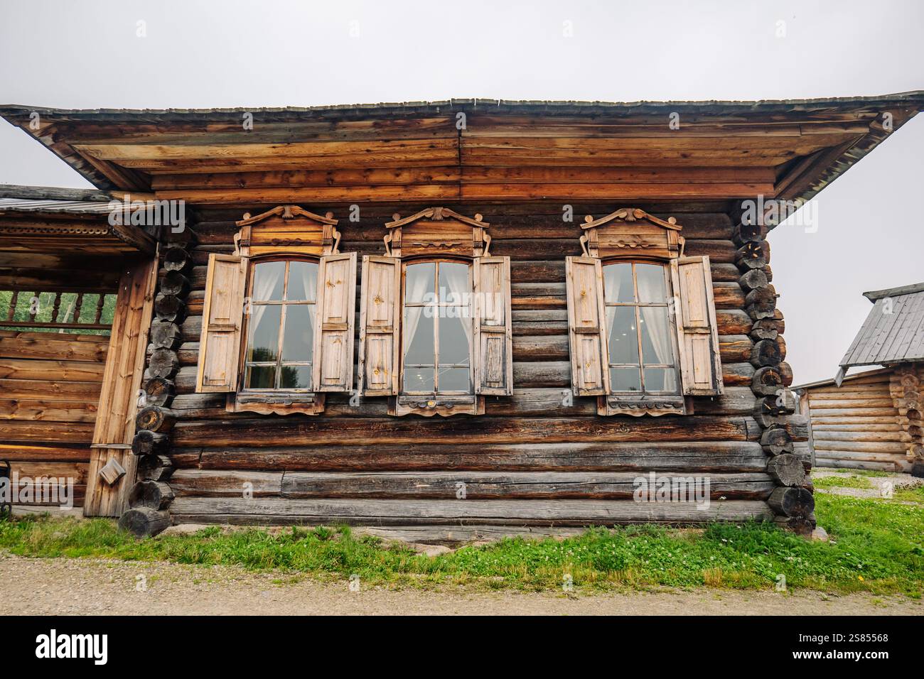 Rustic charm of a wooden house in russia, showcasing intricate window ...