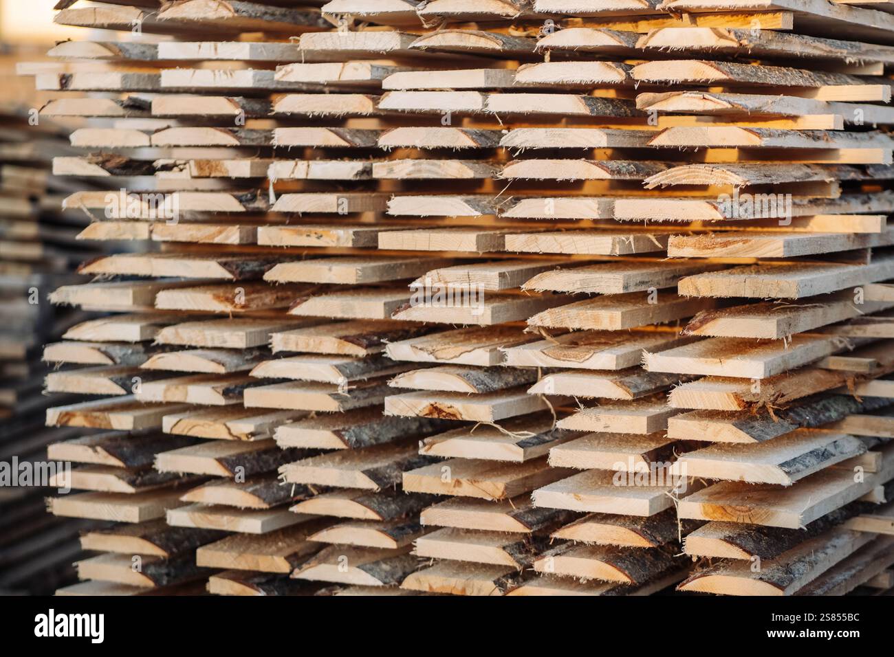 Wooden planks neatly stacking, creating textured surface, representing ...