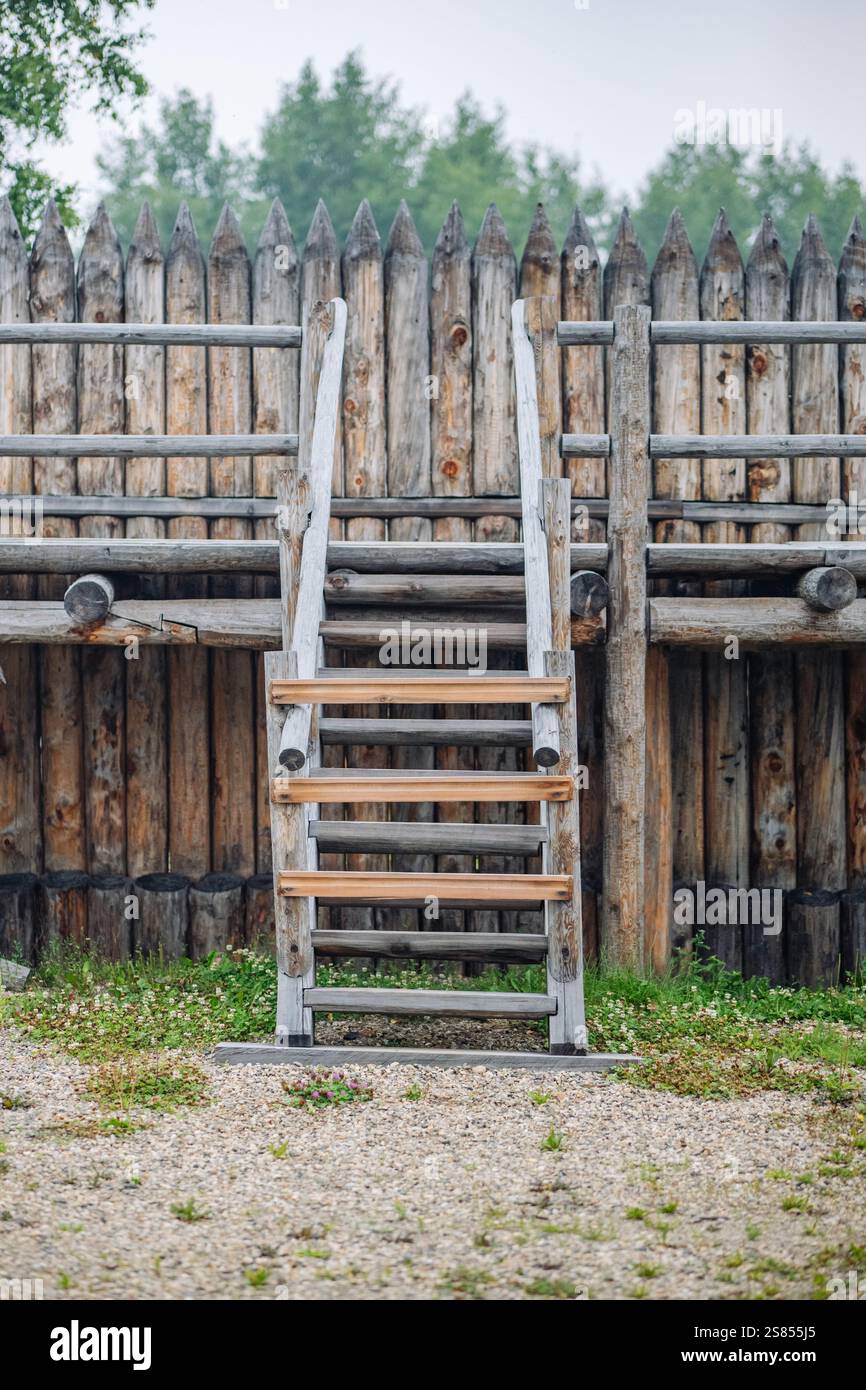 Wooden stairs leading to log reinforced defensive wall inside ...