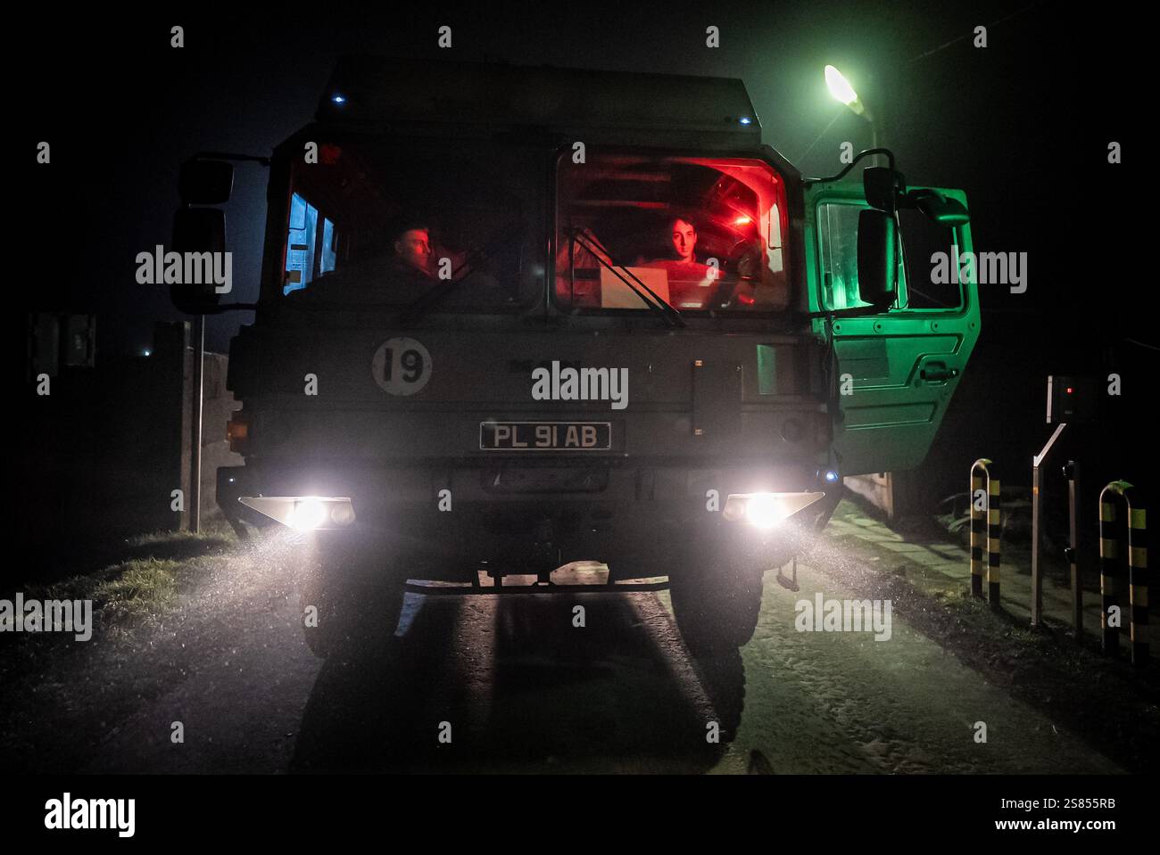 British military vehicles in convoy as they arrive at a Hungarian ...