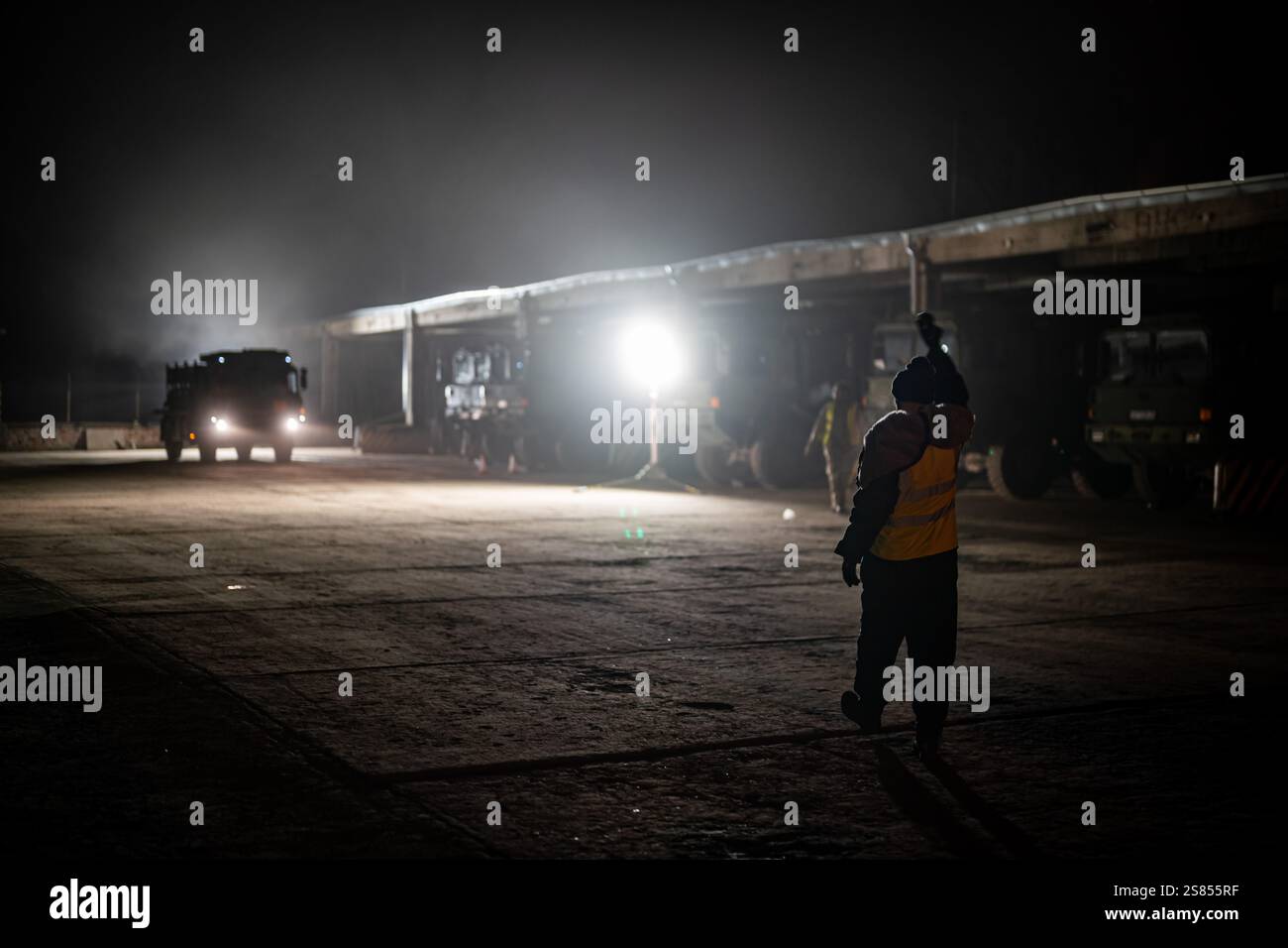 British military vehicles are marshalled as they arrive at a Hungarian ...