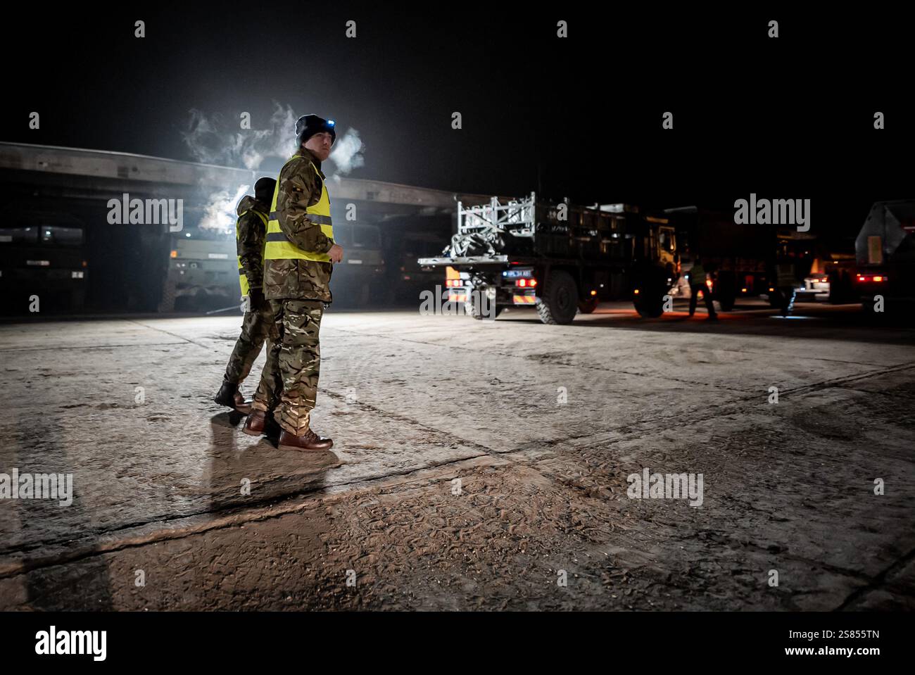 British military vehicles are marshalled as they arrive at a Hungarian ...