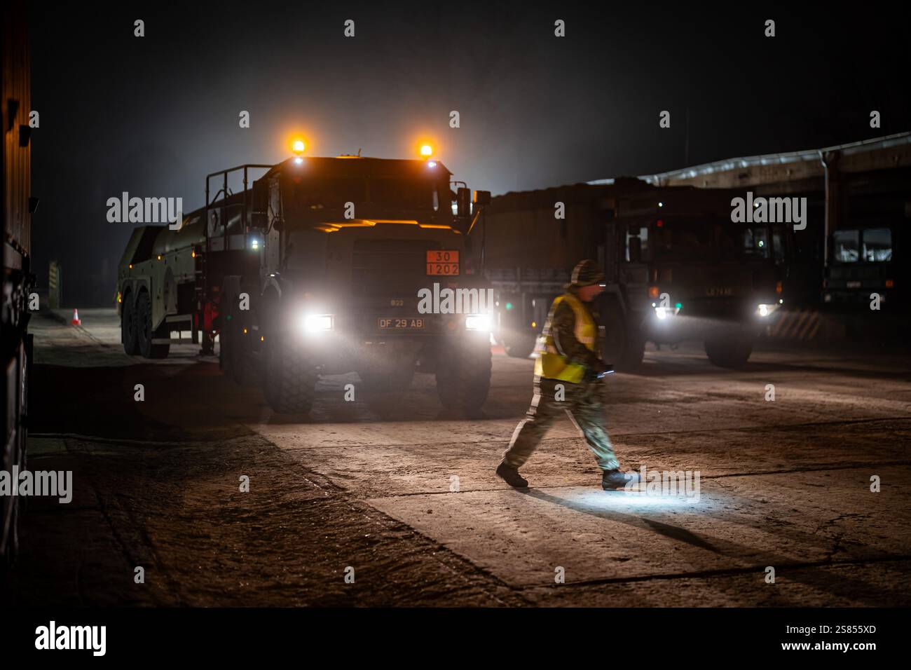 British military vehicles are marshalled as they arrive at a Hungarian ...