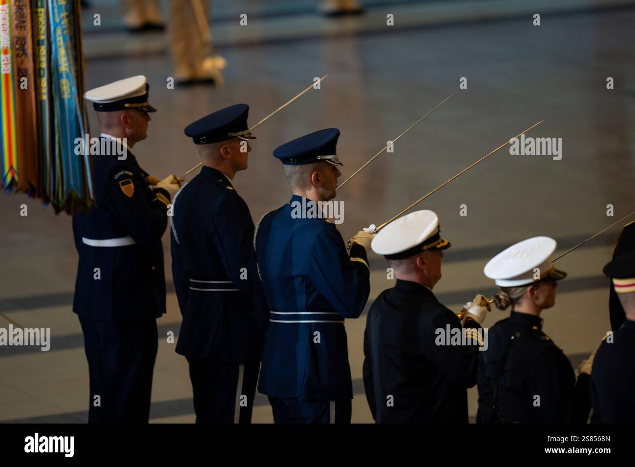 Members of the military stand guard as President Donald Trump reviews ...