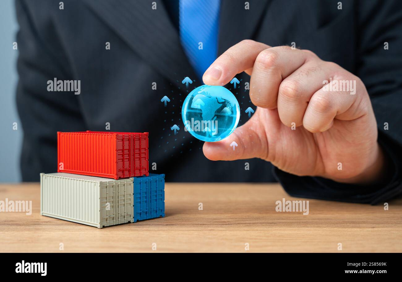 Businessman holding globe of planet Earth over stack of shipping ...