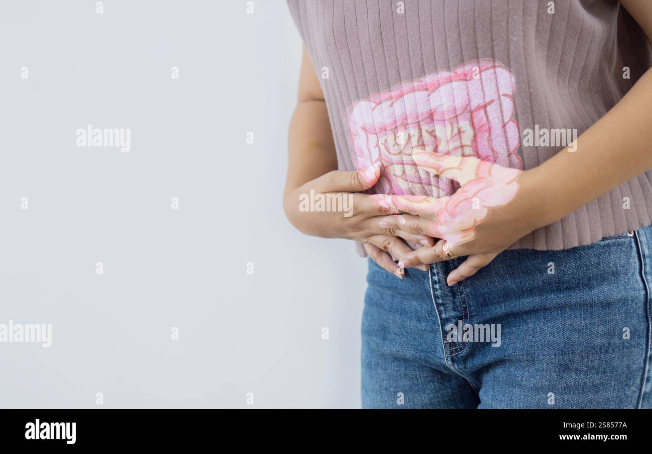 The photo of large intestine is on the woman's body. People with ...
