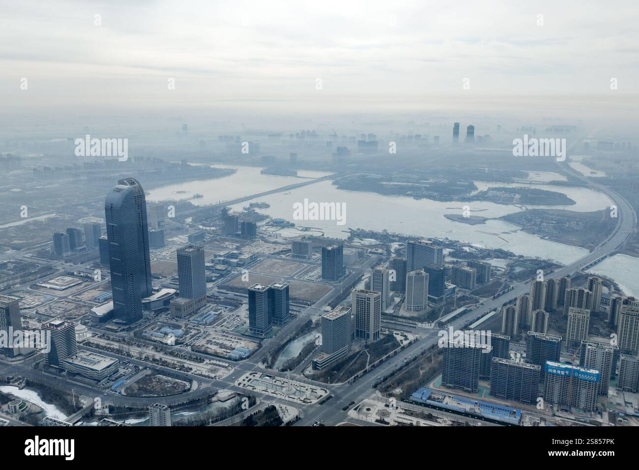 Yinchuan, China. 21st Jan, 2025. A cluster of urban buildings looms in ...