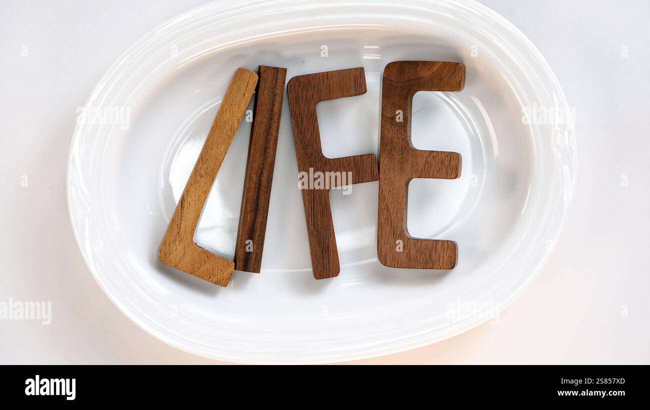 Life, Simply Put: Wooden Letters on a Pristine Backdrop Stock Photo - Alamy