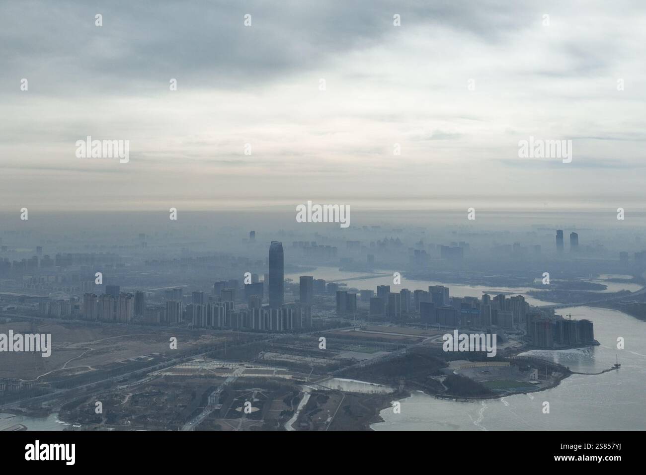 Yinchuan, China. 21st Jan, 2025. A cluster of urban buildings looms in ...