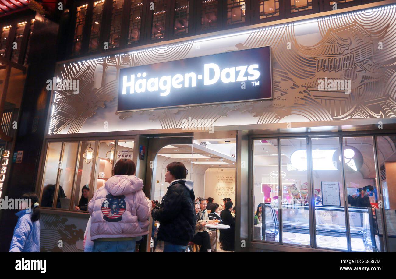 Customers spend money at a Haagen-Dazs ice cream store at Yuyuan Mall in Shanghai, China ...