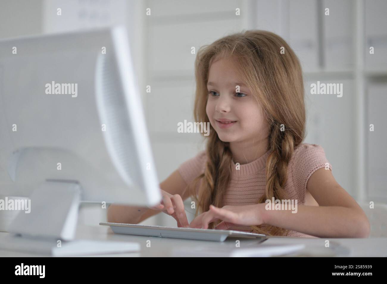 Cute and happy little girl children using laptop computer Stock Photo ...