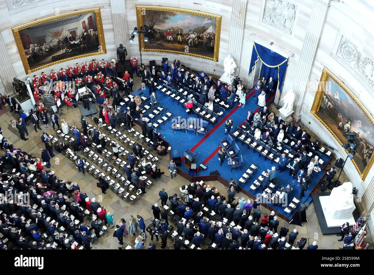 WASHINGTON, DC - JANUARY 20: People take their seats in the Rotunda ...