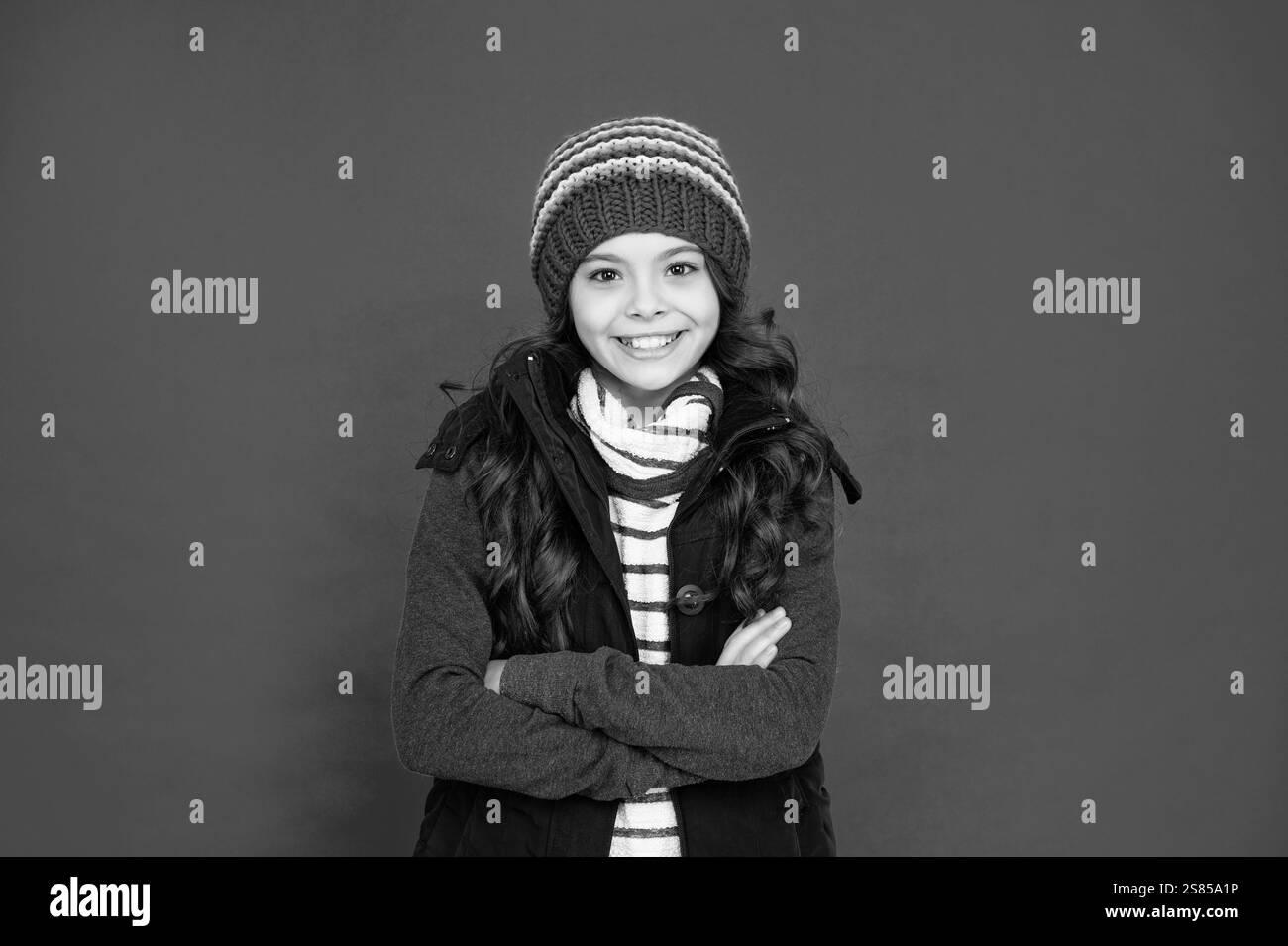 express positive emotion. winter fashion. happy kid with curly hair in ...