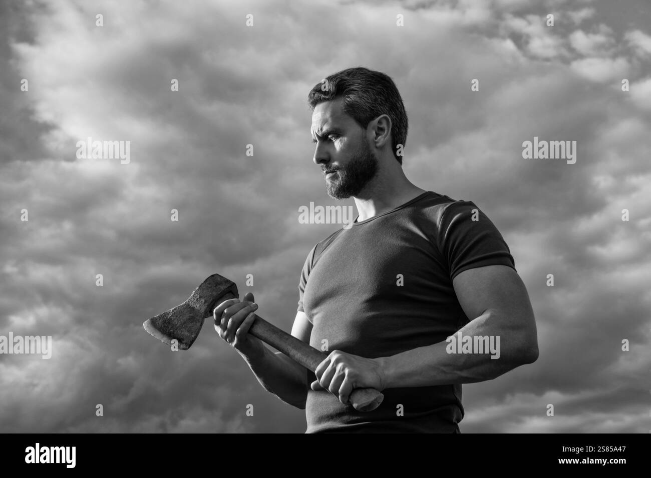 man with axe. craftsman man hold ax. brutal man on dramatic sky ...