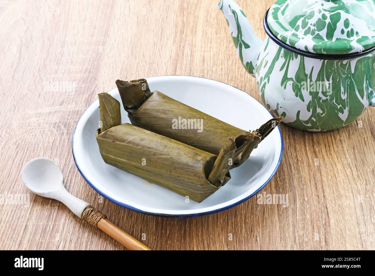 Arem-arem, a traditional Indonesian food made from rice filled with vegetables, chicken, meat or ...