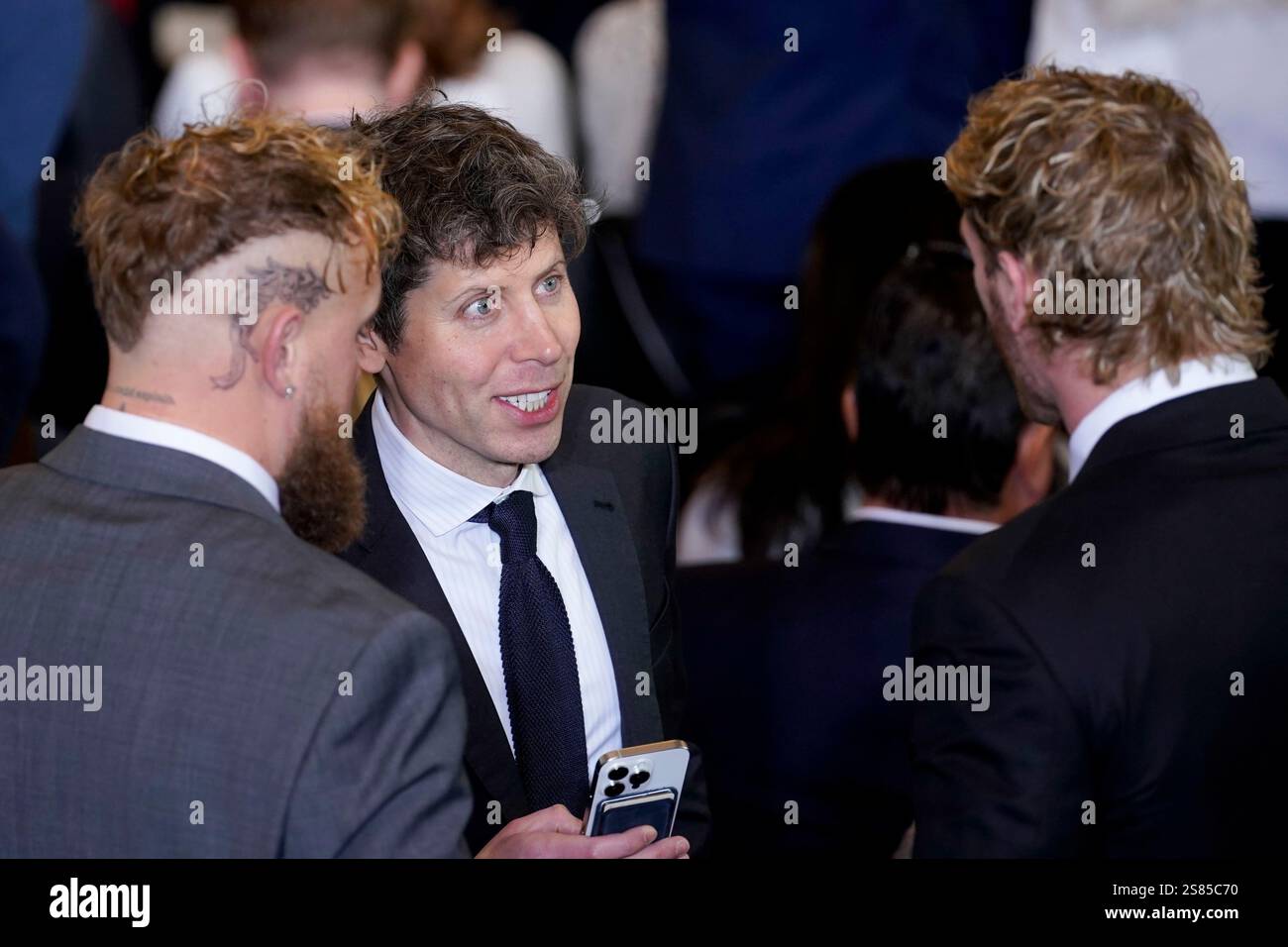 Sam Altman, chief executive officer of OpenAI Inc., center, with boxer ...