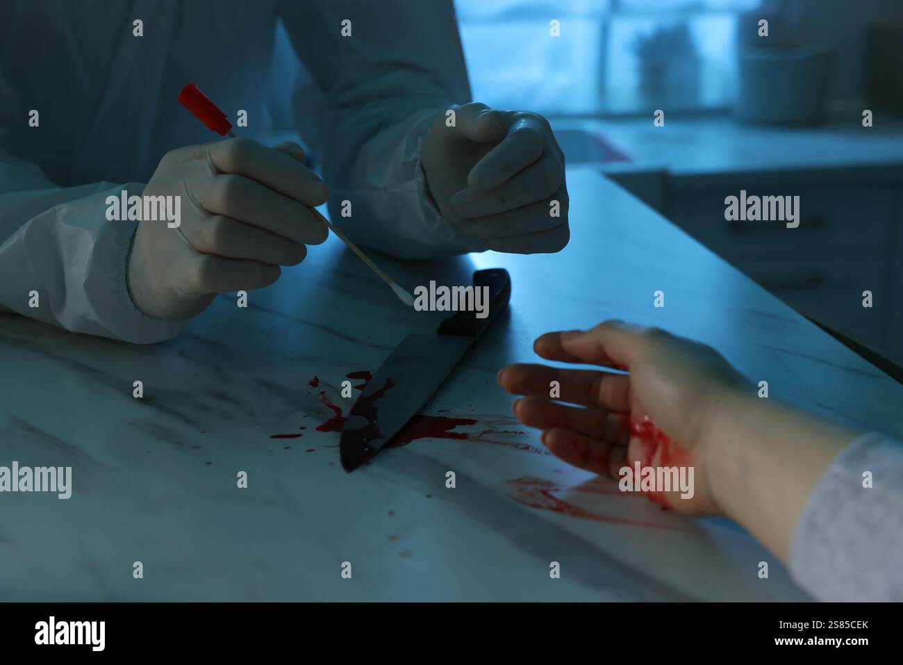 Forensic expert taking blood sample and dead woman's body at countertop ...