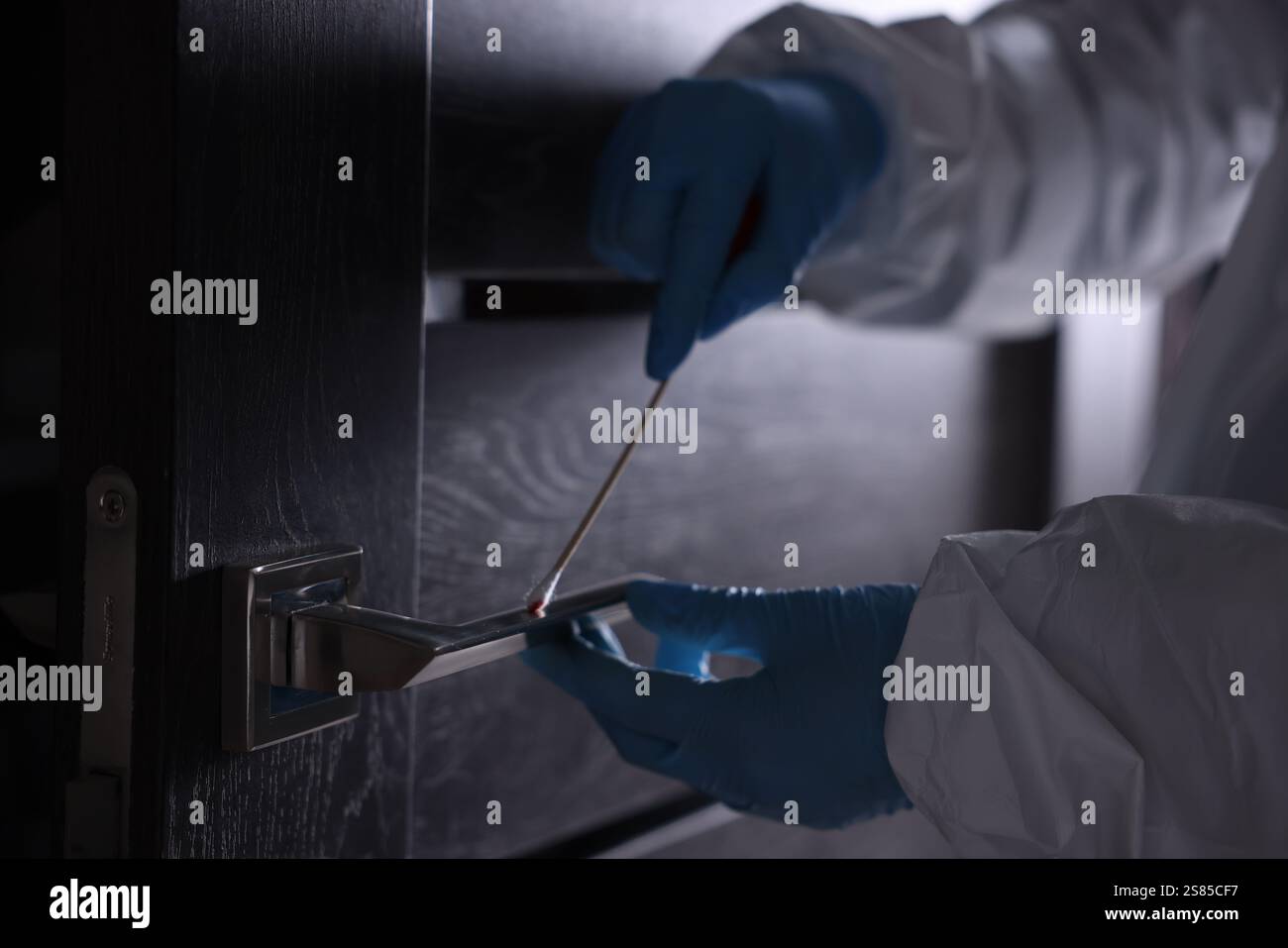 Forensic expert taking blood sample from handle of door, closeup Stock ...
