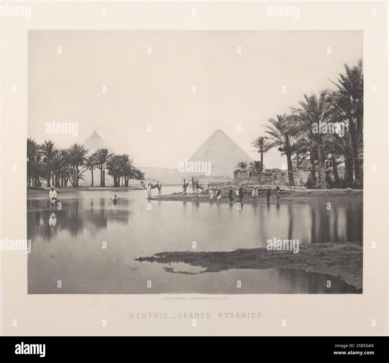 The Great Pyramid of Memphis, Egypt, with locals by the water. Vintage ...