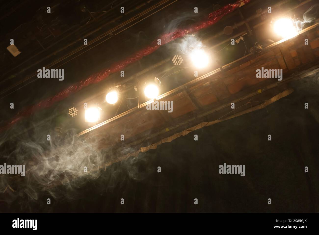 Professional spotlights and smoke on stage in theatre, low angle view ...