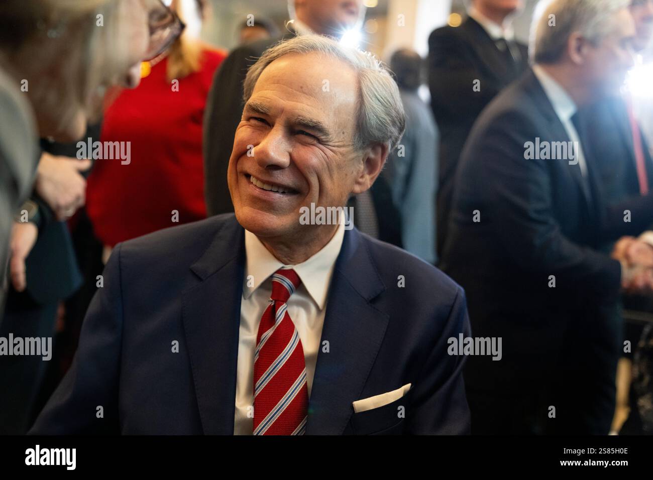 Texas Governor Greg Abott (R) is seen in an overflow room for President ...