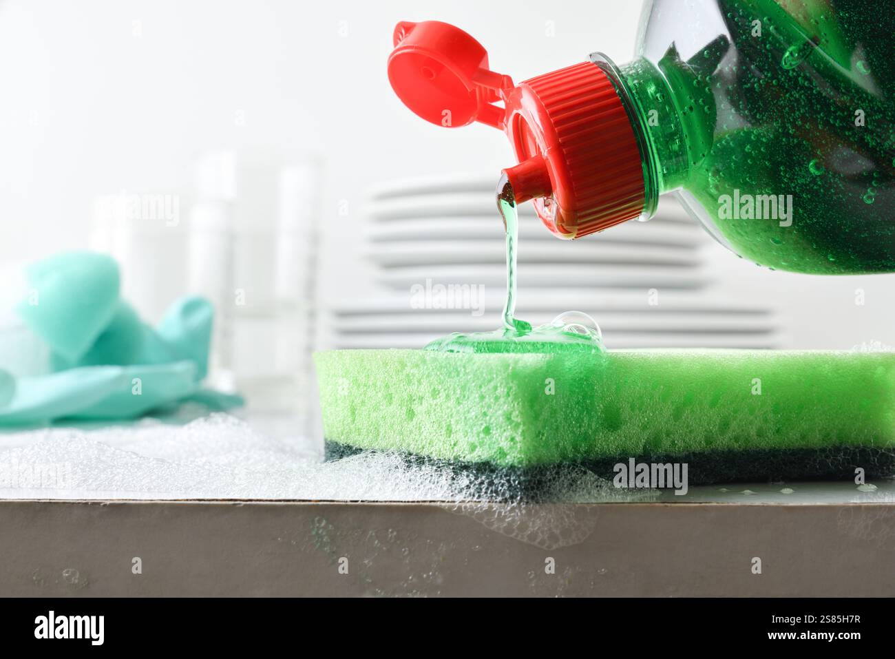 Pouring detergent on a sponge in hi-res stock photography and images ...