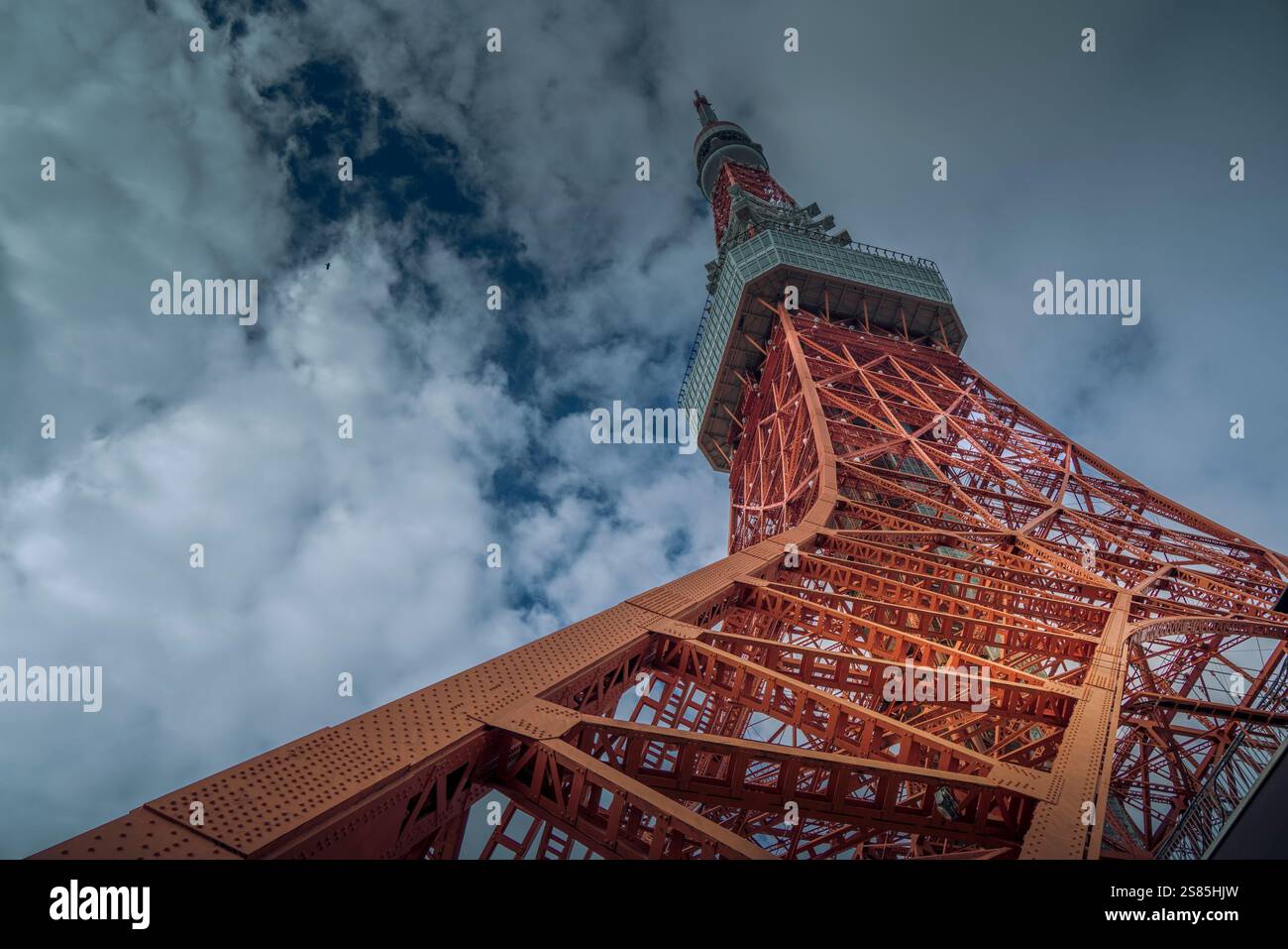 View of Tokyo Tower from its base against cloudy sky, Shibakoen, Minato ...