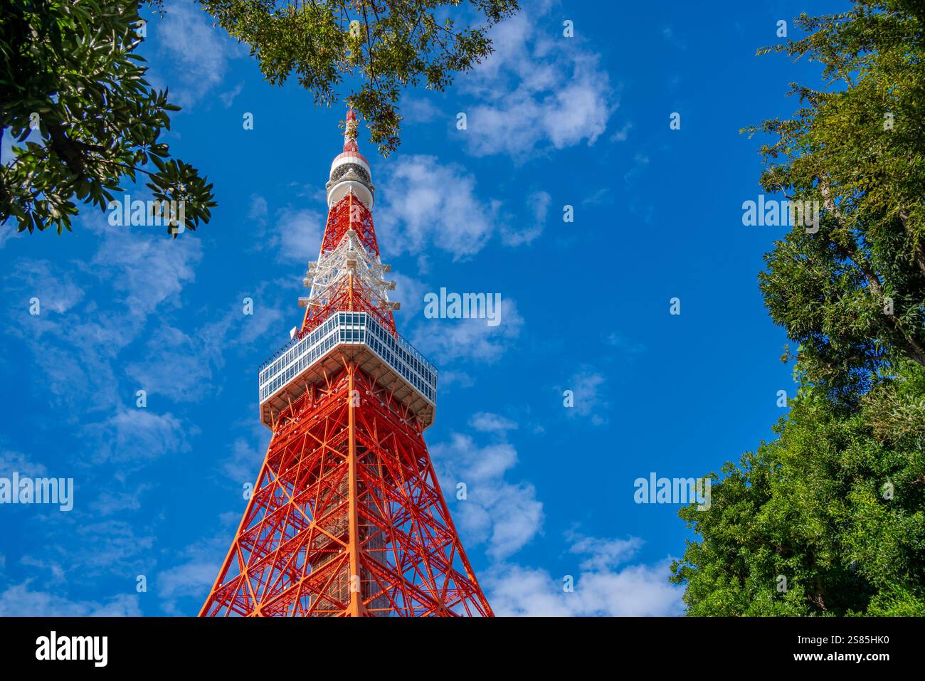 View of Tokyo Tower from its base against blue sky, Shibakoen, Minato ...