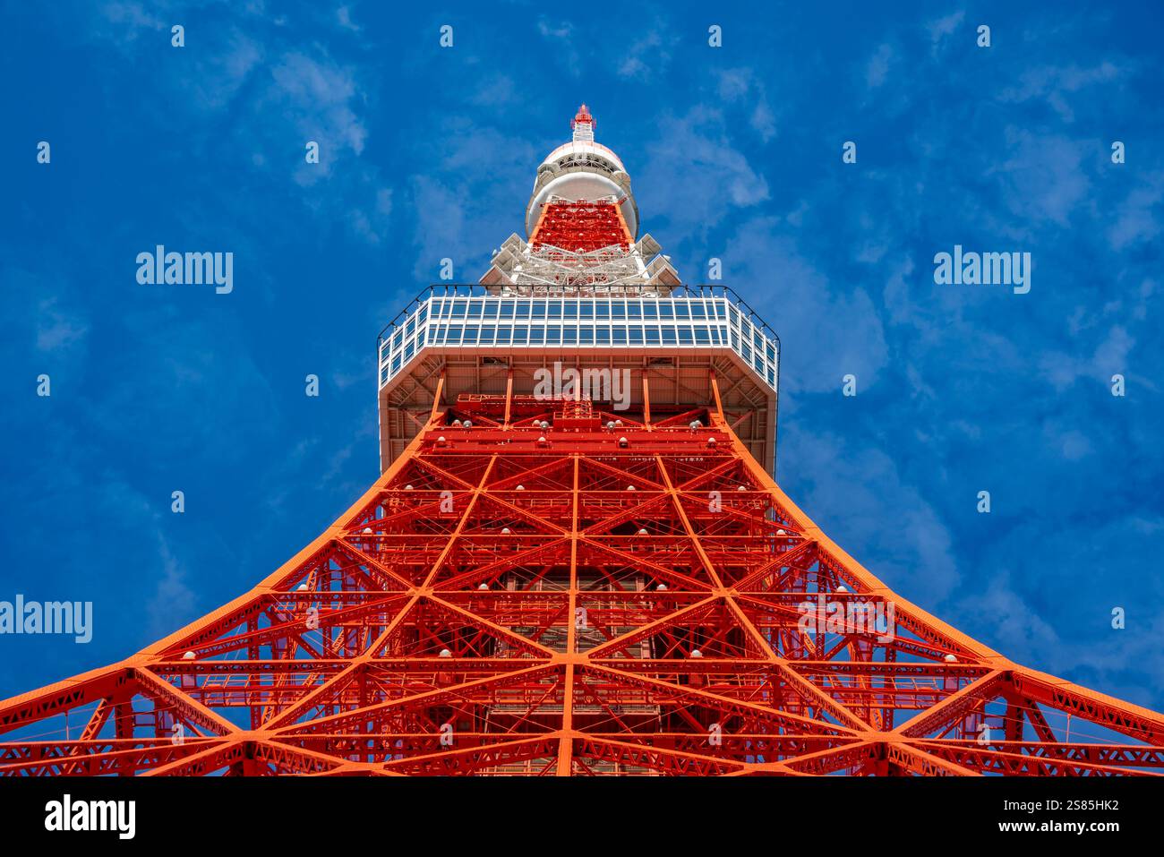 View of Tokyo Tower from its base against blue sky, Shibakoen, Minato ...