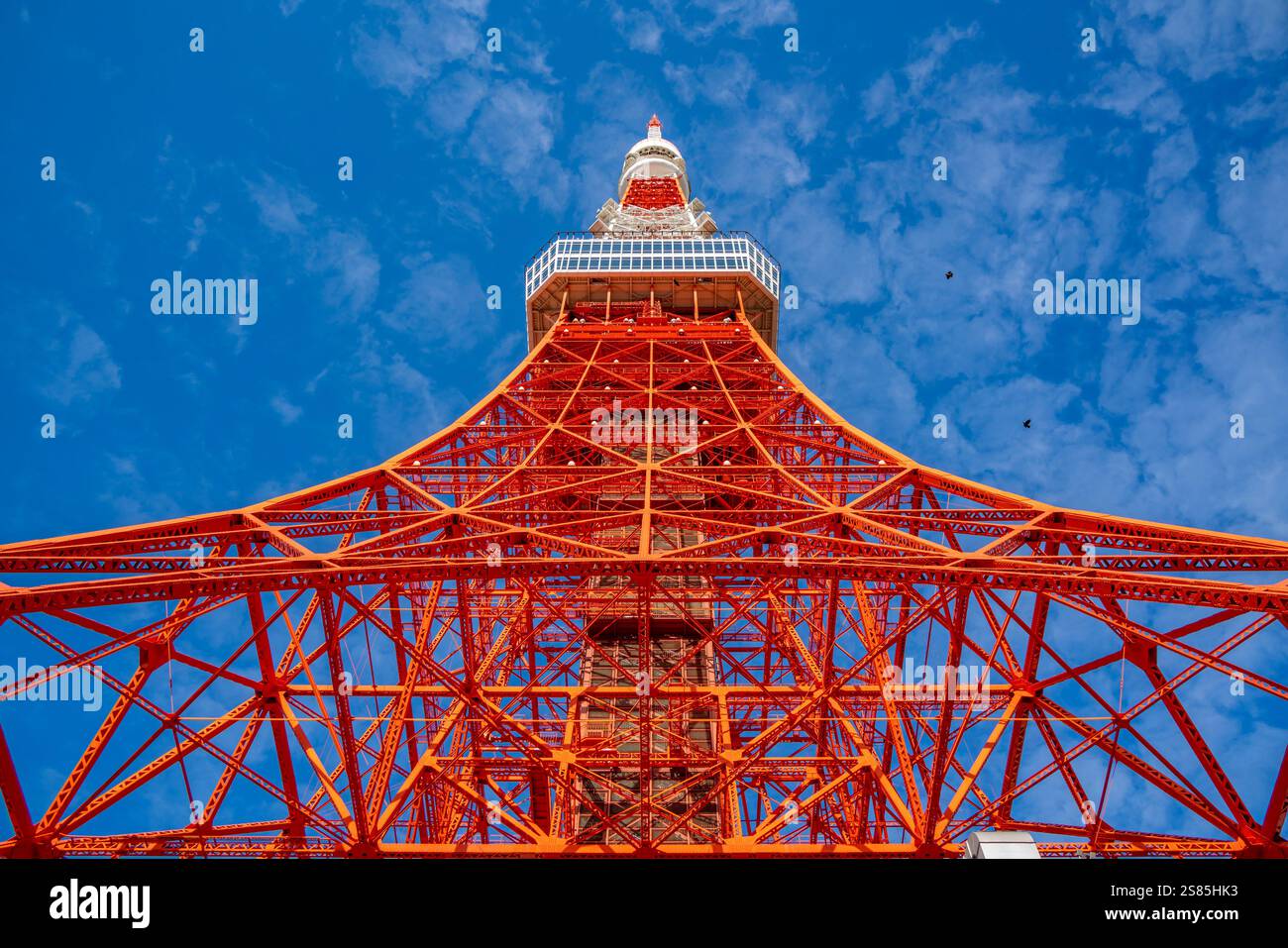 View of Tokyo Tower from its base against blue sky, Shibakoen, Minato ...