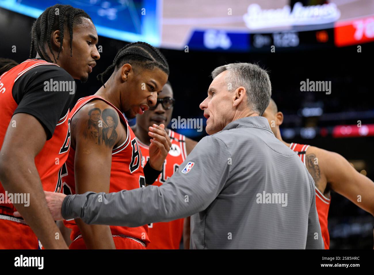 Chicago Bulls head coach Billy Donovan, right, talks to his players ...