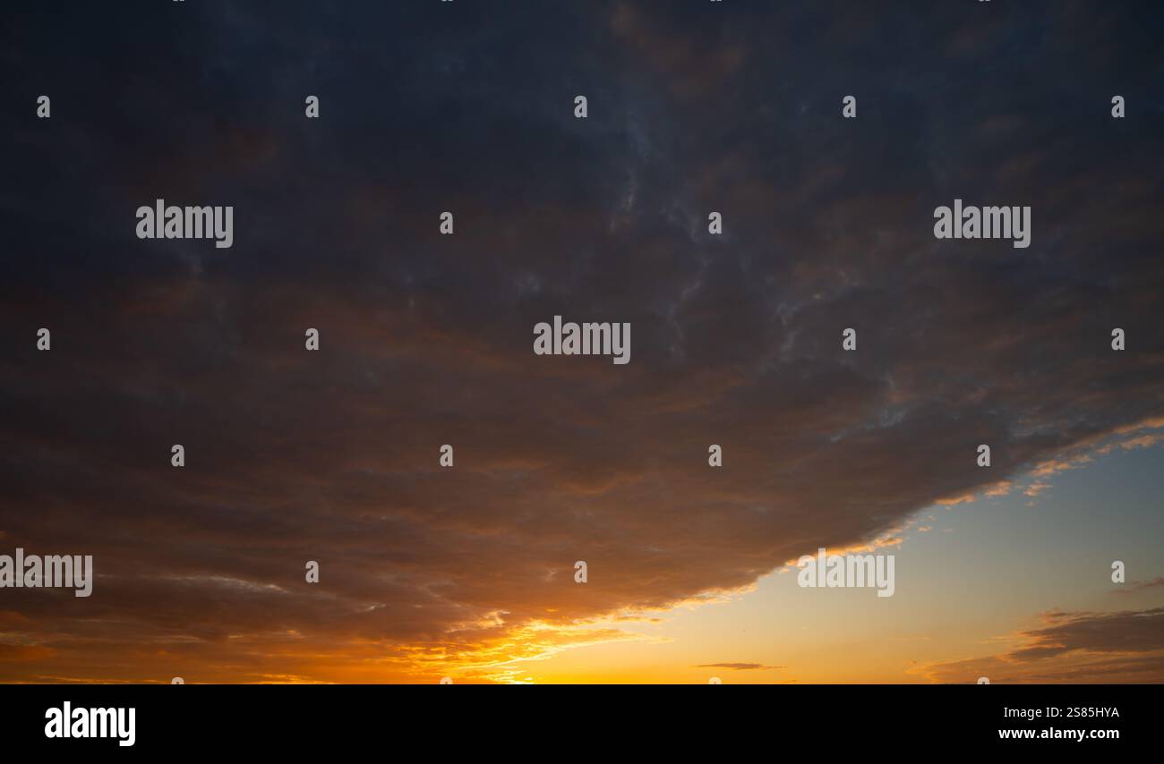 Sunset or sunrise. Dramatic majestic scenery sunset. Sky with clouds in ...