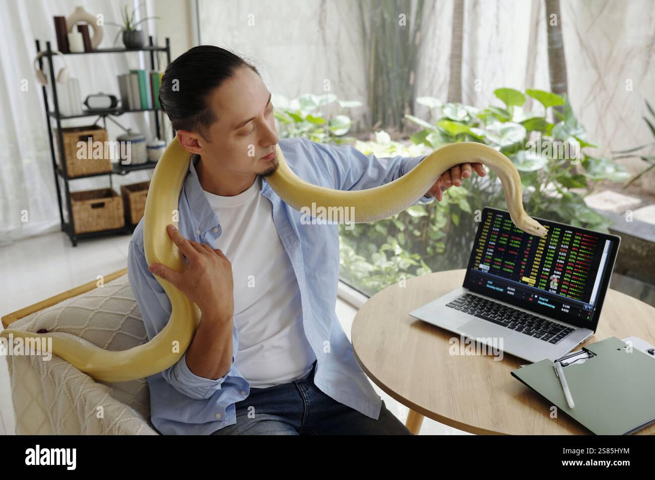 Man near snake hi-res stock photography and images - Alamy
