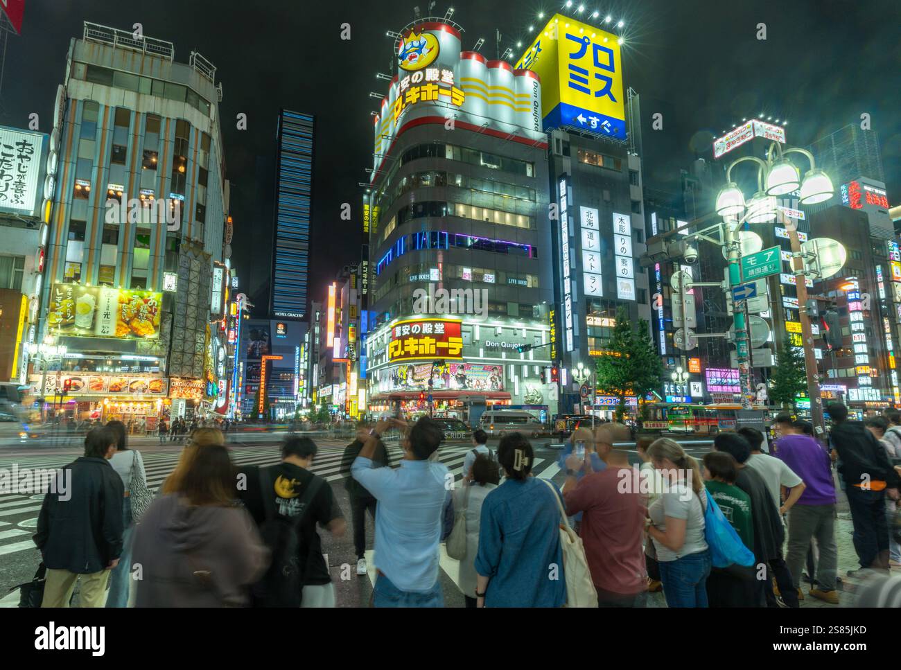 View of Kabukicho neon lit street and crossings at night, Shinjuku City ...