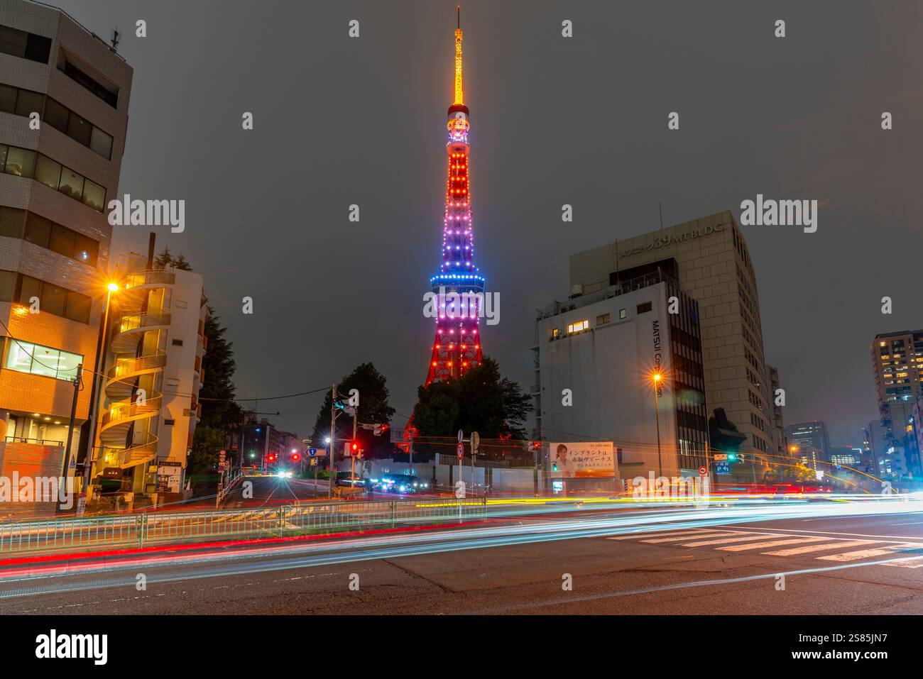 View of Tokyo Tower and city buildings at night, Minato City, Tokyo ...