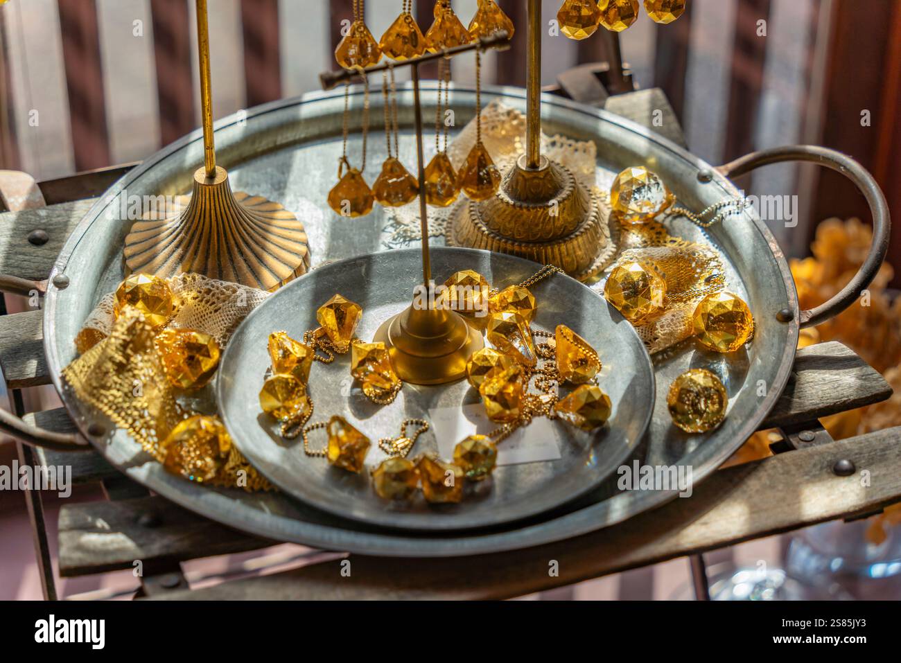 View of gold jewellery on display in shop window in the Higashi Chaya ...