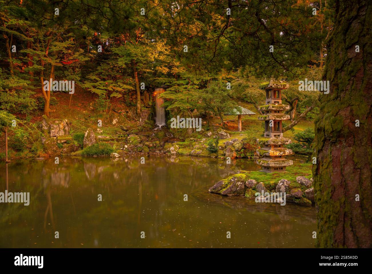 View of Hisago-ike Pond, Kaiseki Pagoda and waterfall in Kenrokumachi Japanese Garden, Kanazawa ...