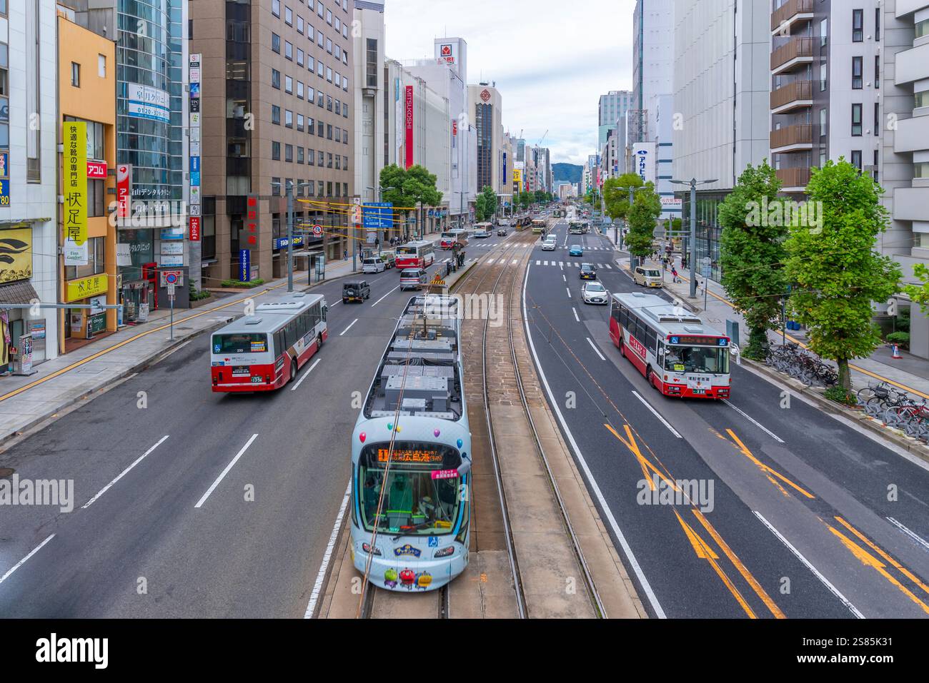 Elevated view of traffic and tram on major street during daytime ...