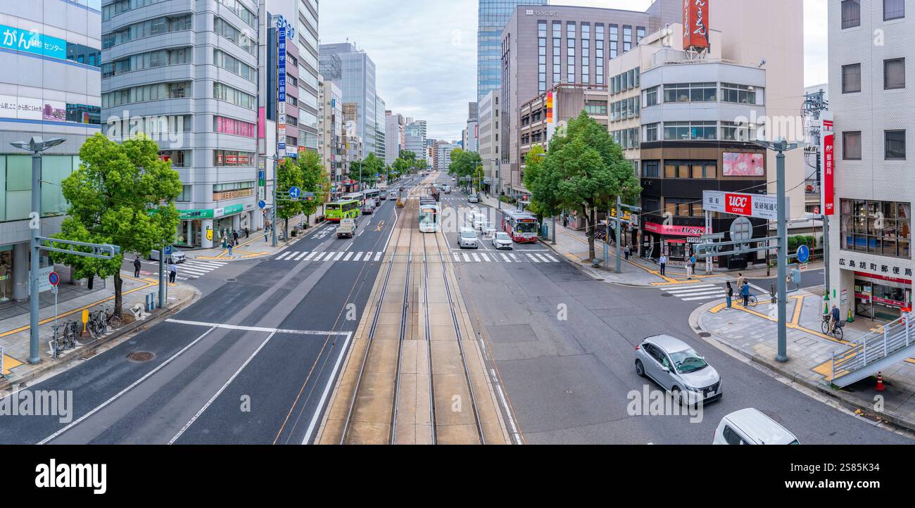 Elevated view of traffic and tram on major street during daytime ...