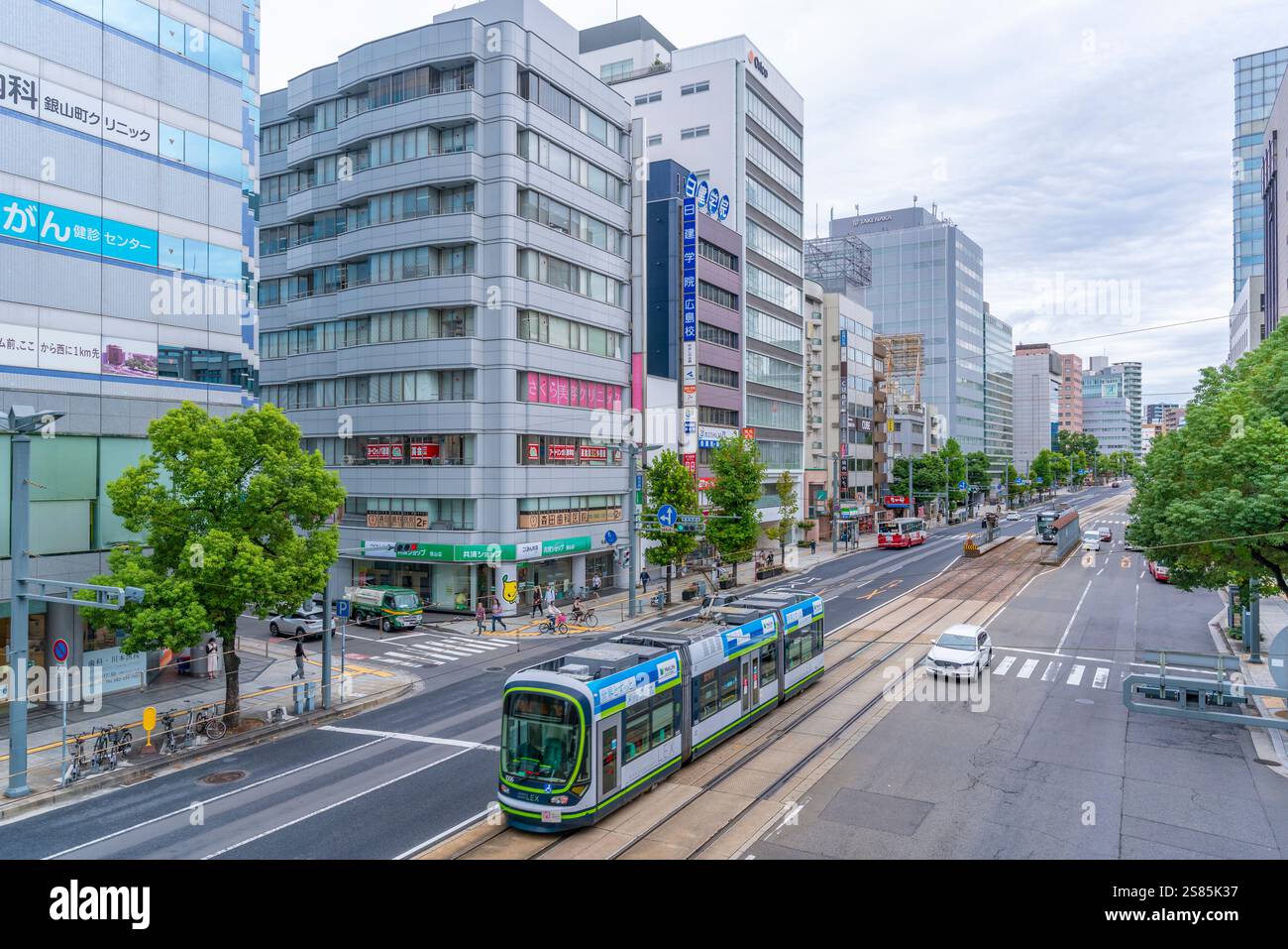 Elevated view of traffic and tram on major street during daytime ...