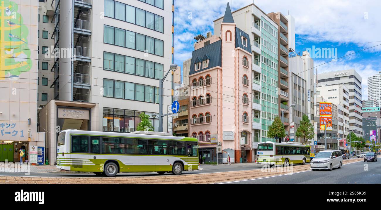 View of city buses on major street during daytime, Hondori, Naka Ward ...