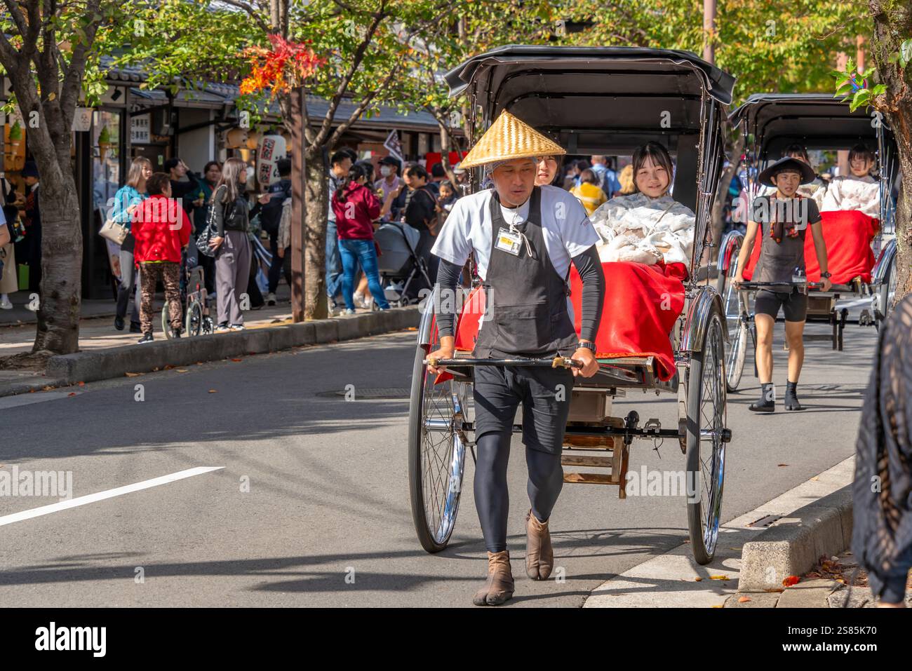 View of rickshaws near Togetsukyo Bridge over Katsura River ...