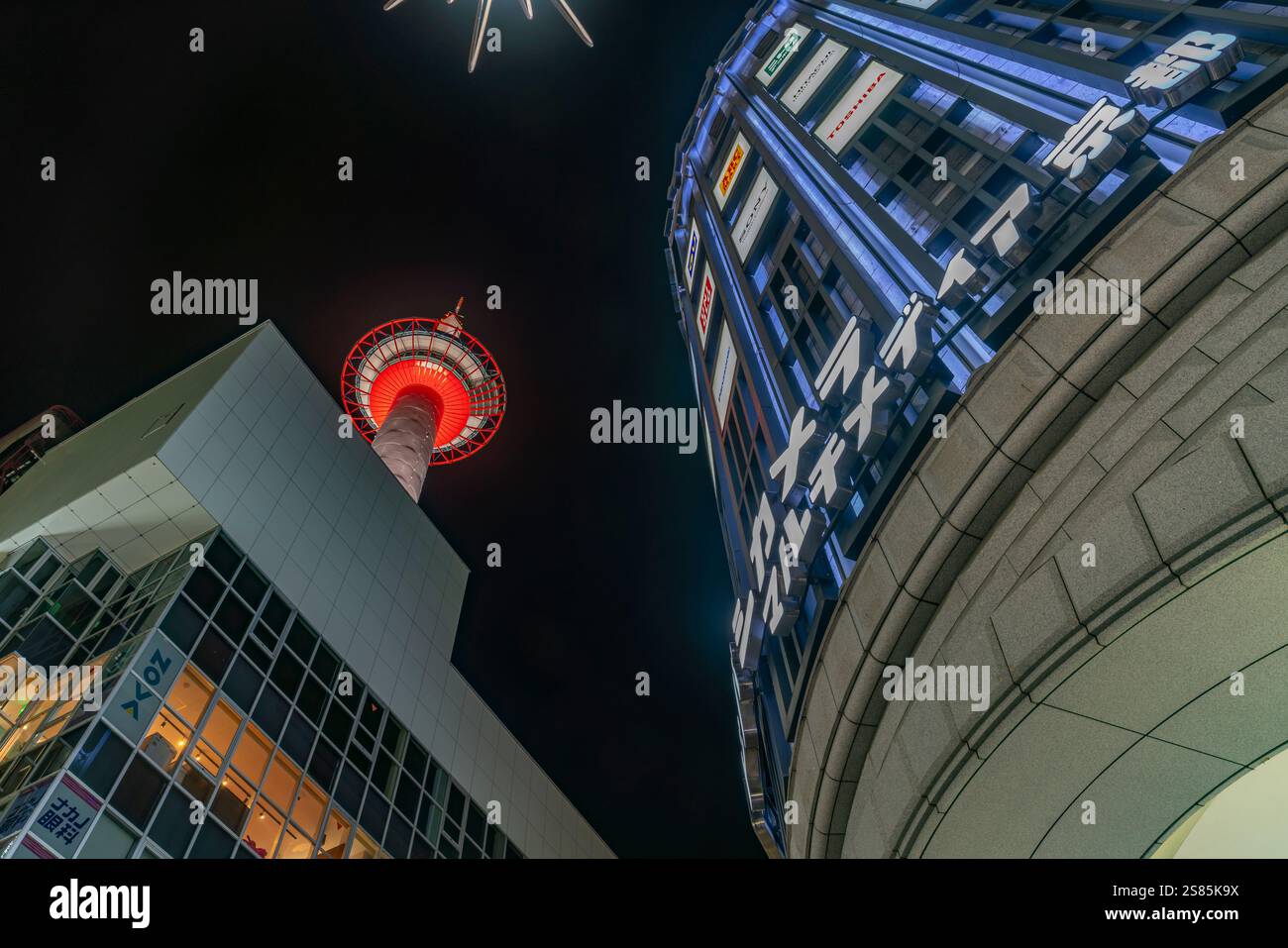 View of Nidec Kyoto Tower and nearby buildings at night, Shimogyo Ward ...