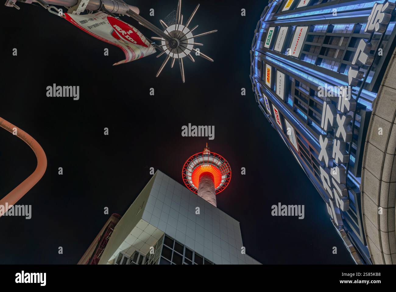 View of Nidec Kyoto Tower and nearby buildings at night, Shimogyo Ward ...