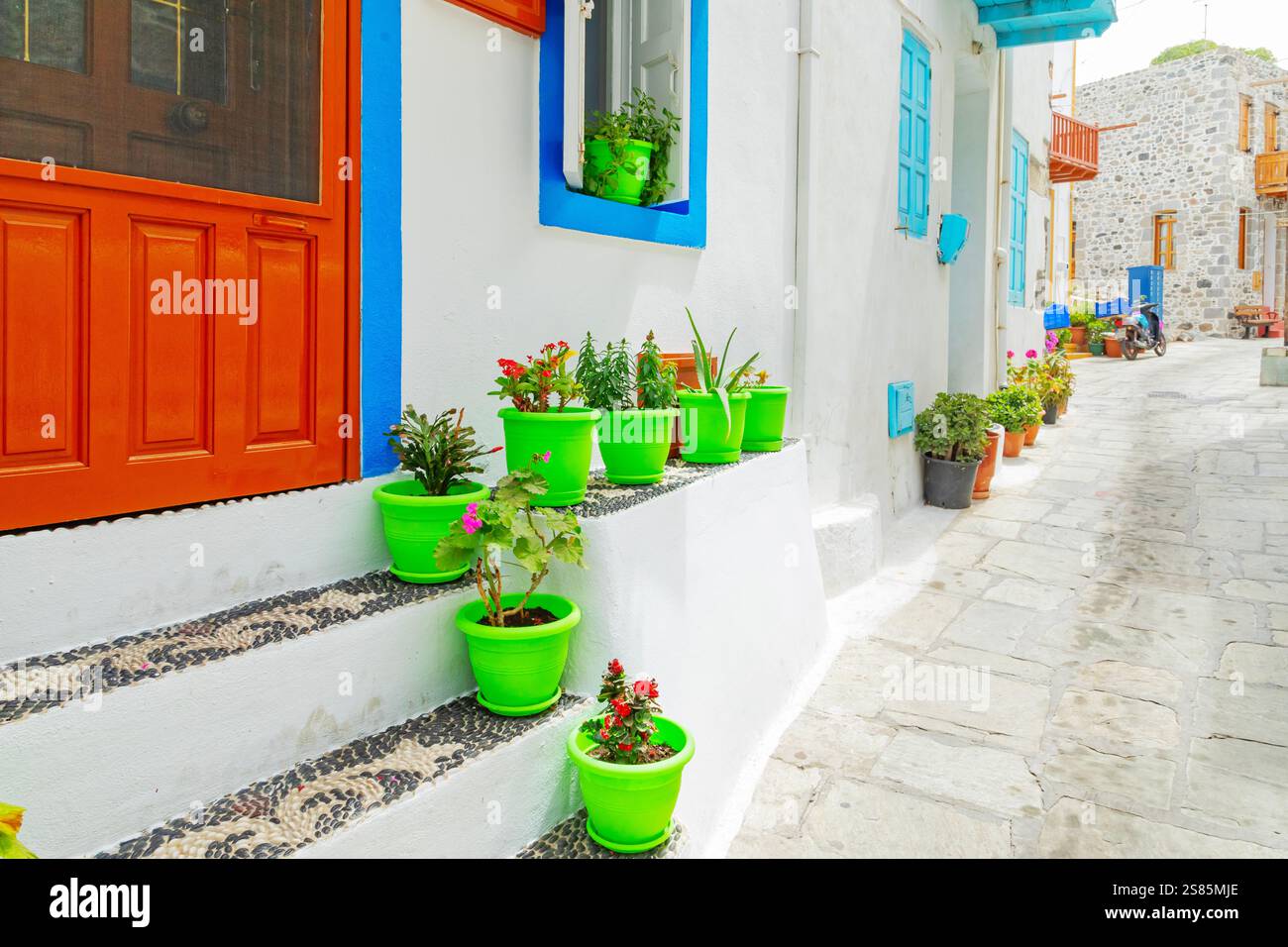 Potted plants at traditional house entrance, Mandraki, Nisyros Island ...